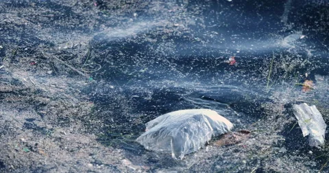 Close up of a plastic bag and other junk... | Stock Video | Pond5