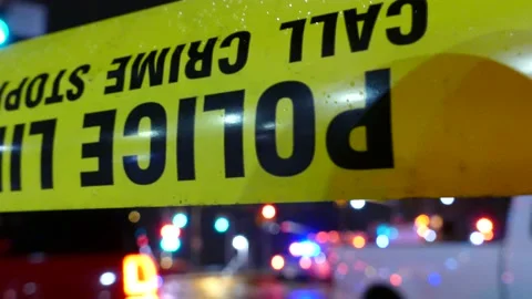 Close up of police line waving in front ... | Stock Video | Pond5