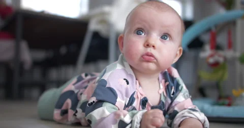 close portrait of baby girl staring with... | Stock Video | Pond5