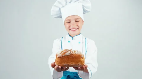 Close up portrait baker holds bread in h... | Stock Video | Pond5