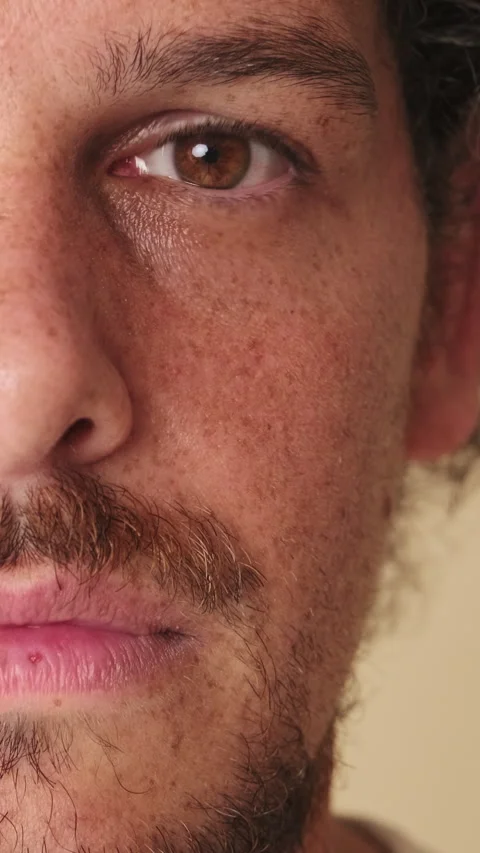 Close-up portrait half face of man looki... | Stock Video | Pond5