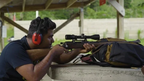 Close Up Portrait Of A Man Shooting A Ri... | Stock Video | Pond5