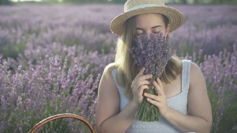 Close-up portrait of smiling girl sniffi... | Stock Video | Pond5