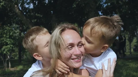 Close up portraits of mom with two sons ... | Stock Video | Pond5