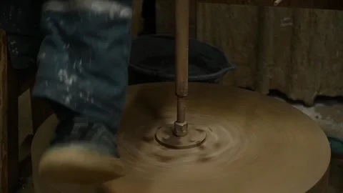 Close-up of a potters foot spinning a tr... | Stock Video | Pond5