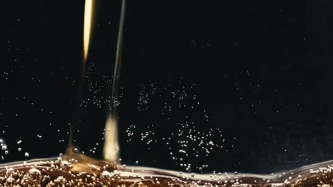 Close-up poured Coke - bubbles rising | Stock Video | Pond5