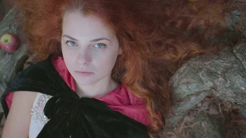 Close-up of pretty young nymph in black ... | Stock Video | Pond5