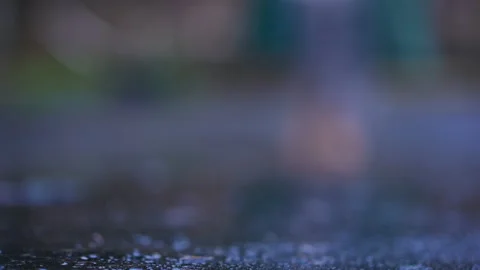 Close-up rain falling in slow motion wit... | Stock Video | Pond5