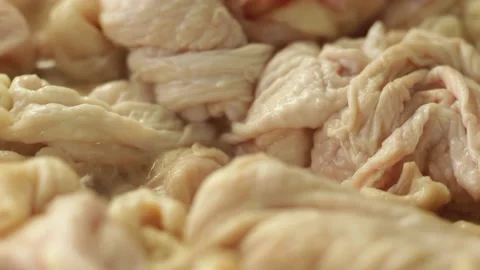 Close up of raw chicken skin is being bo... | Stock Video | Pond5