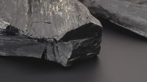 Close up of Raw Jet stone rock rotating ... | Stock Video | Pond5