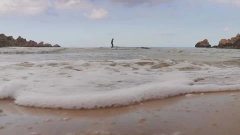 Close-up of the receding wave an surfer ... | Stock Video | Pond5