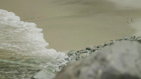 Close up of river water on white sandy b... | Stock Video | Pond5
