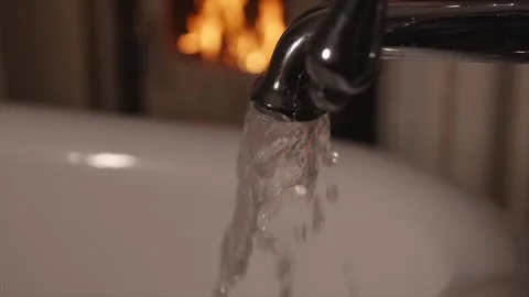 Close up of running bath tap with firepl... | Stock Video | Pond5
