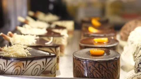 Close up of selection of chocolate cakes... | Stock Video | Pond5