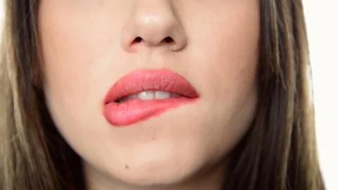 Close up of sensuous woman mouth bite he... | Stock Video | Pond5
