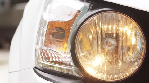 Close up shot of blinking headlights in ... | Stock Video | Pond5