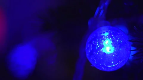 Close-up shot of a blue lightbulb flashi... | Stock Video | Pond5