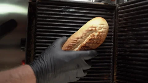 Close-up shot of hot dog bun laying on g... | Stock Video | Pond5