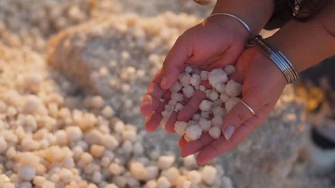 Close up shot palms of girl dropping sal... | Stock Video | Pond5