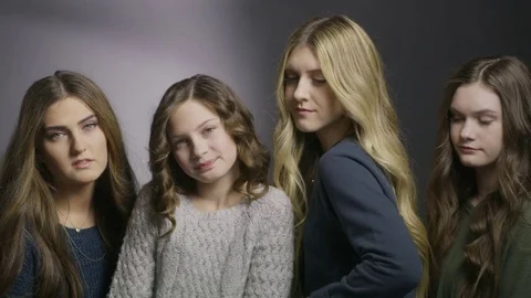 Close up shot of portrait of four sister... | Stock Video | Pond5