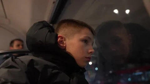 Close-up shot of sad boy sitting in the ... | Stock Video | Pond5