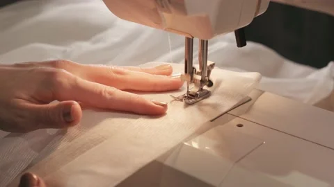 Close-up shot of sewing machine sews a l... | Stock Video | Pond5