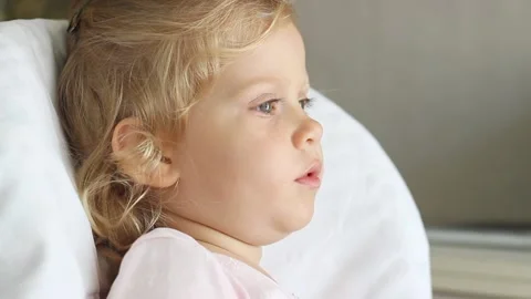 Close up side view of a child girl. The ... | Stock Video | Pond5