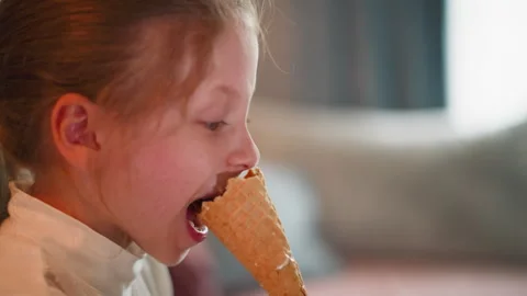 Close Up Side View of Kid Licking Ice Cr... | Stock Video | Pond5