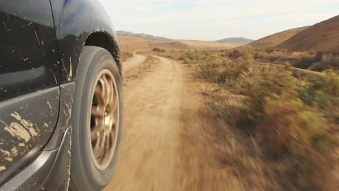 Close up side view of wheel spin on sand... | Stock Video | Pond5