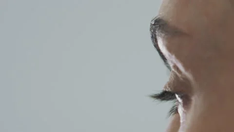 Close-up side view of woman face and eye... | Stock Video | Pond5