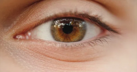 Close up on single human eye looking aro... | Stock Video | Pond5