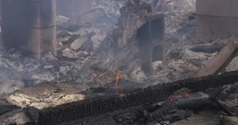 Close-up smoldering rubble of a burned s... | Stock Video | Pond5