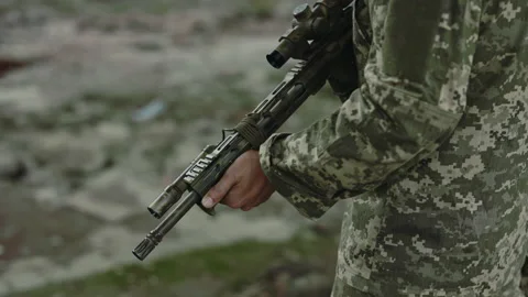 Close up of soldier holding assault rifl... | Stock Video | Pond5