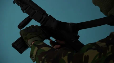 Close up of Soldier Reloading Gun Isolat... | Stock Video | Pond5