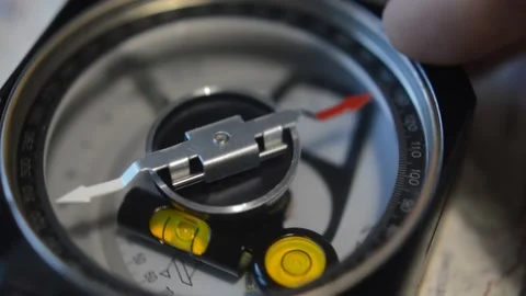 close-up spinning arrow of the compass f... | Stock Video | Pond5