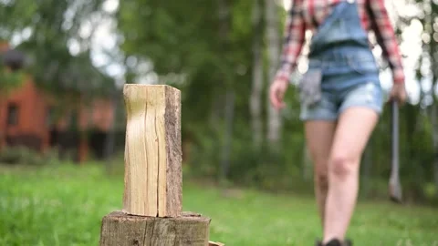 Close-up of splitting a log. A woman cho... | Stock Video | Pond5