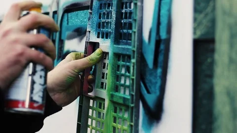 Close up of a spray can artist spraying ... | Stock Video | Pond5