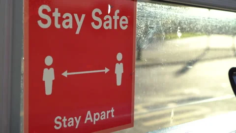 Close up of Stay Safe pandemic bus stop ... | Stock Video | Pond5