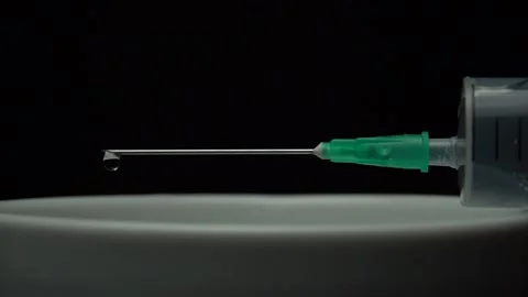 Close-up of syringe needle with drop iso... | Stock Video | Pond5