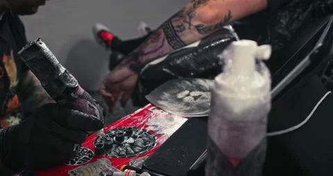 Close up tattoo artist shows the process... | Stock Video | Pond5