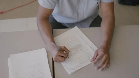 Close-up of Teacher Grading Papers at Hi... | Stock Video | Pond5