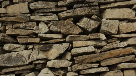Close-up texture of old stone wall 4K ti... | Stock Video | Pond5