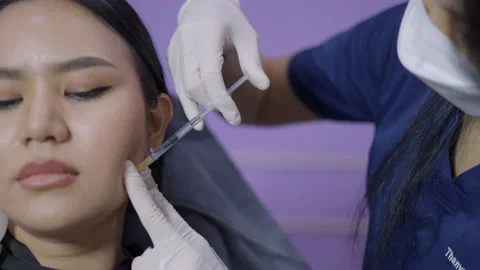 Close up of thai doctor applying botox o... | Stock Video | Pond5