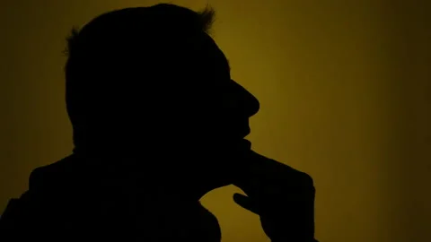 Close-up of a thoughtful person in silho... | Stock Video | Pond5
