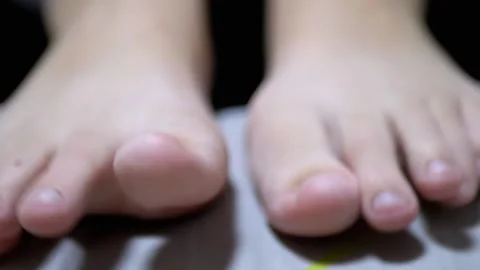 Close-up Tired Child Wiggles his Toes wh... | Stock Video | Pond5