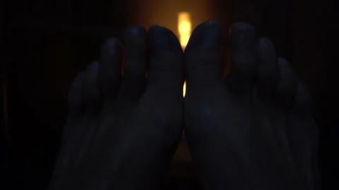 Close up toes on bare feet warming again... | Stock Video | Pond5