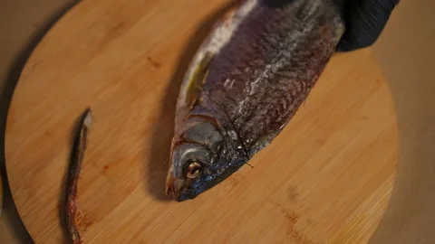 Close-up top view cutting fish head with... | Stock Video | Pond5