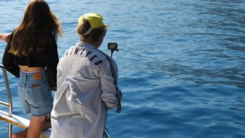 Close-up of two girls standing on deck, ... | Stock Video | Pond5