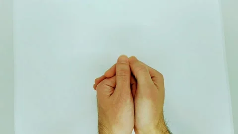 close-up of two hands and folded fingers... | Stock Video | Pond5