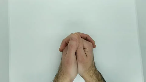 close-up of two hands and folded fingers... | Stock Video | Pond5